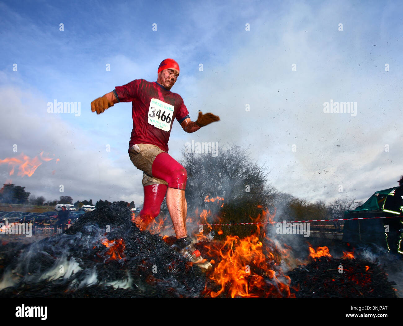 A competitor running in the infamous Tough Guy race in Perton, England ...