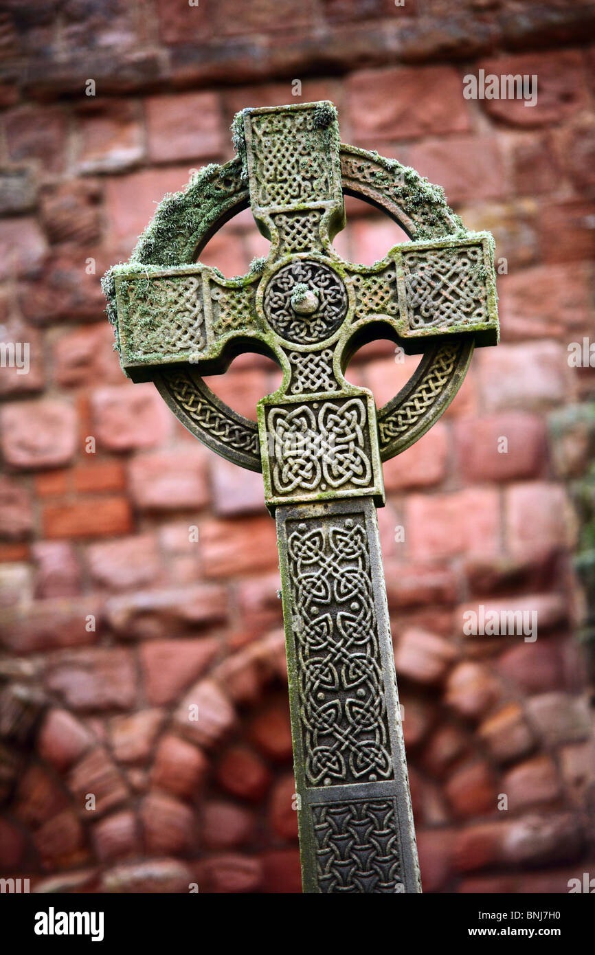 Celtic stone cross at Lindisfarne Priory, Northumberland, England Stock ...