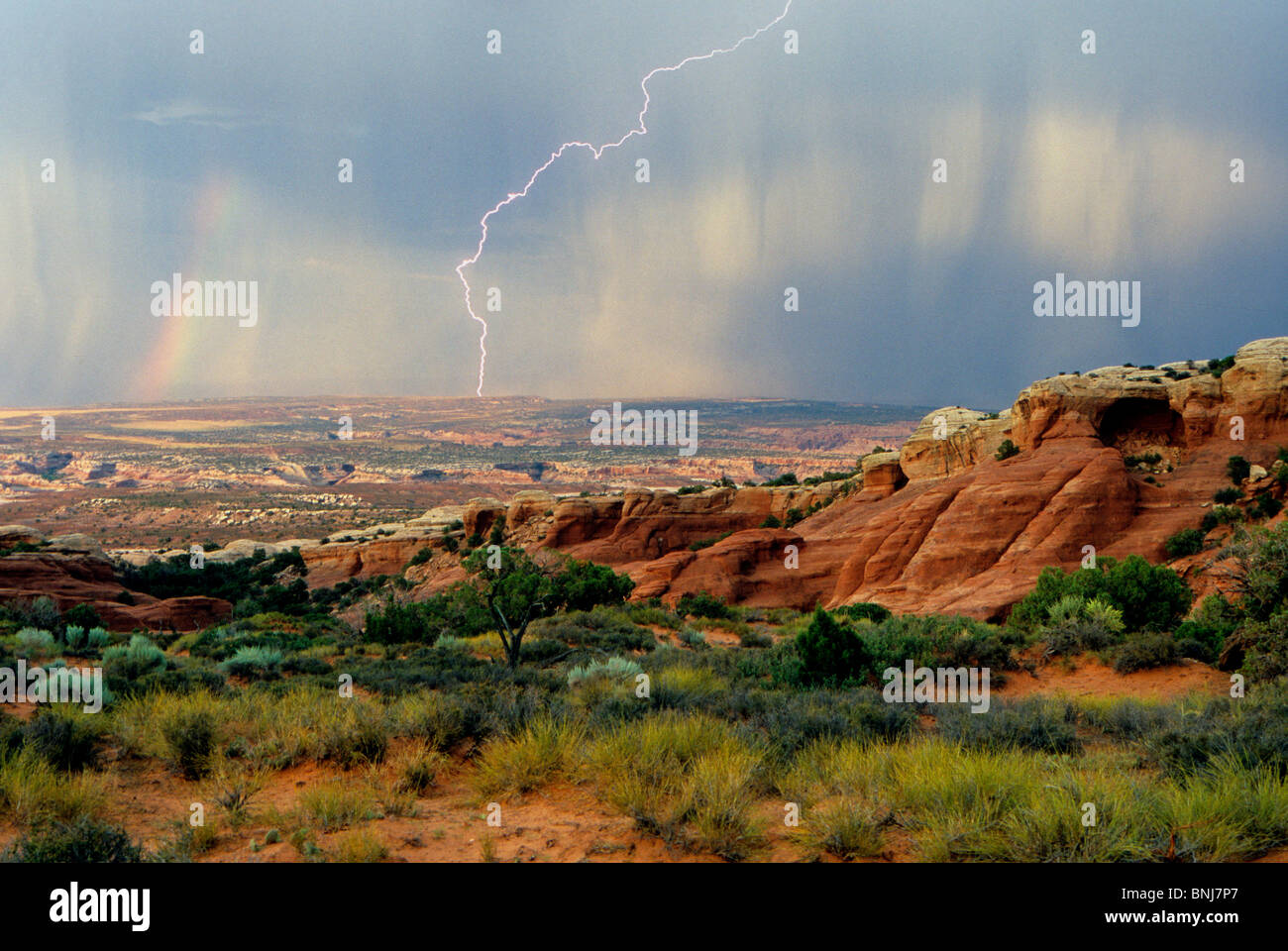 USA Utah national park thunderstorm lightning rainbow rock Arches North ...