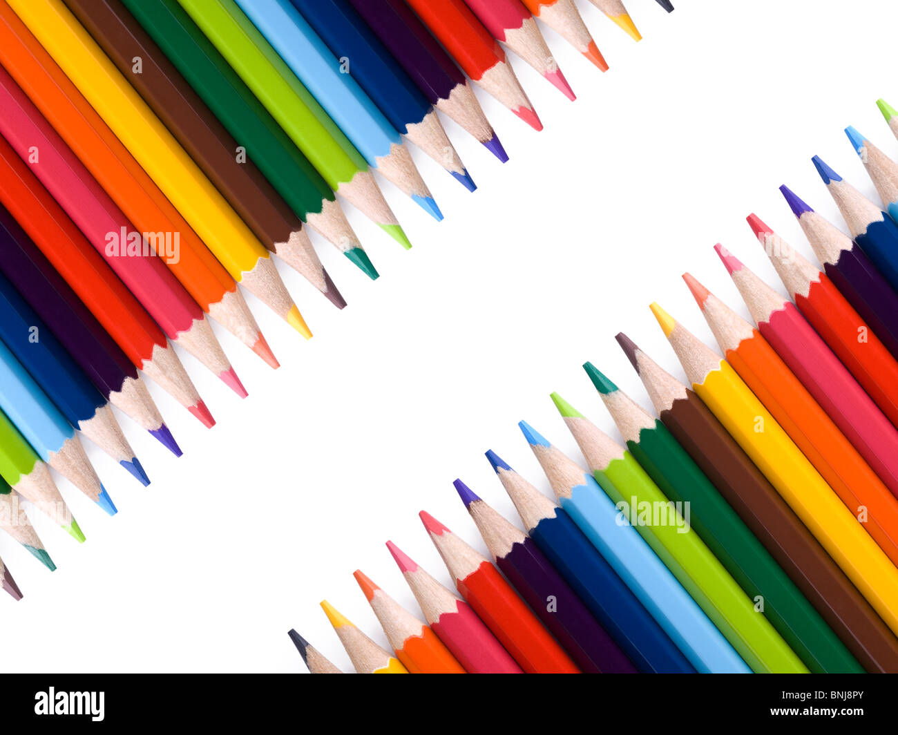 Colored pencils form a frame over a white background. Copy space Stock ...