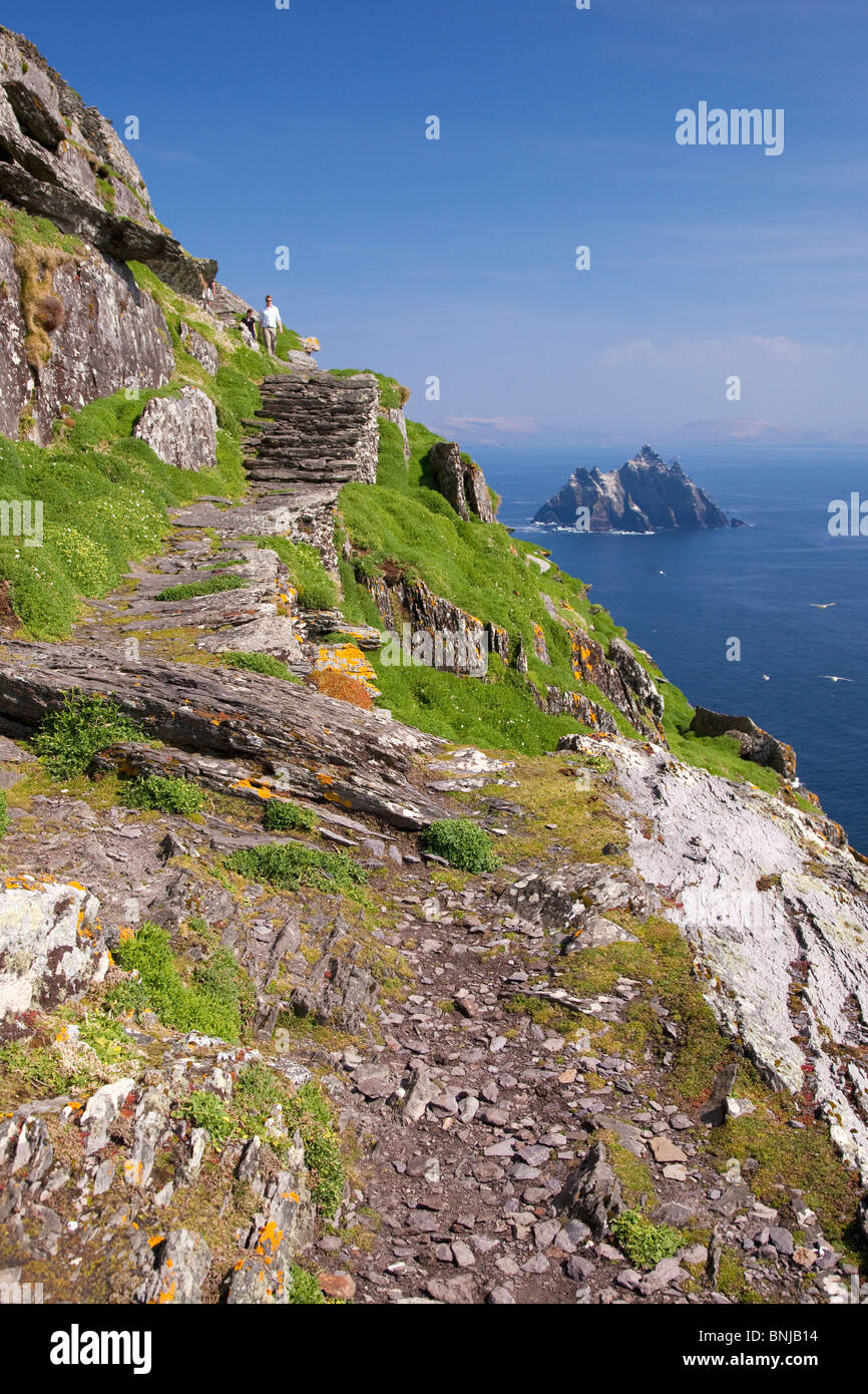Tourist visiting celtic monastic monastery Skellig Michael looking to ...