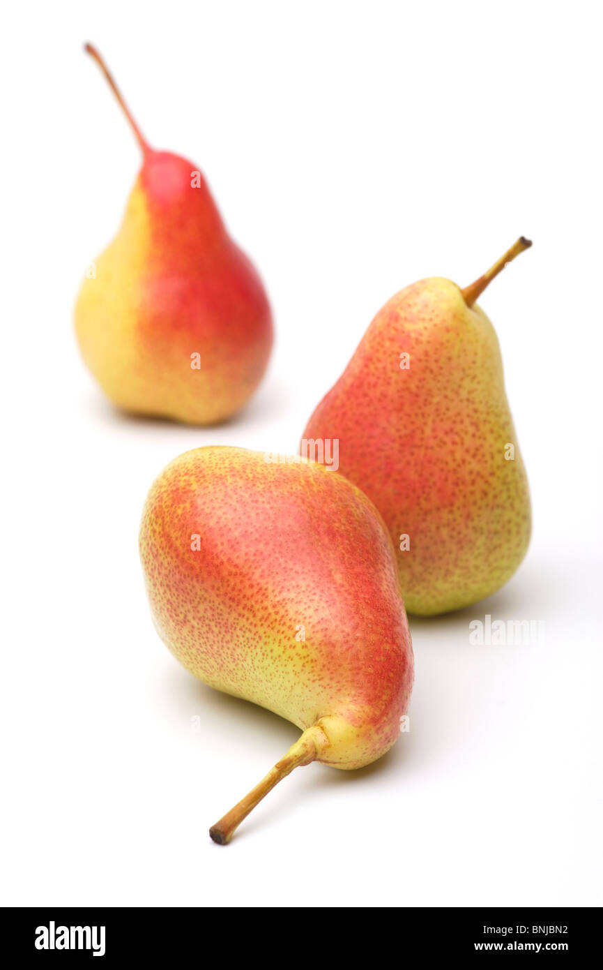 Three ripe yellow-red pears on a white background Stock Photo - Alamy