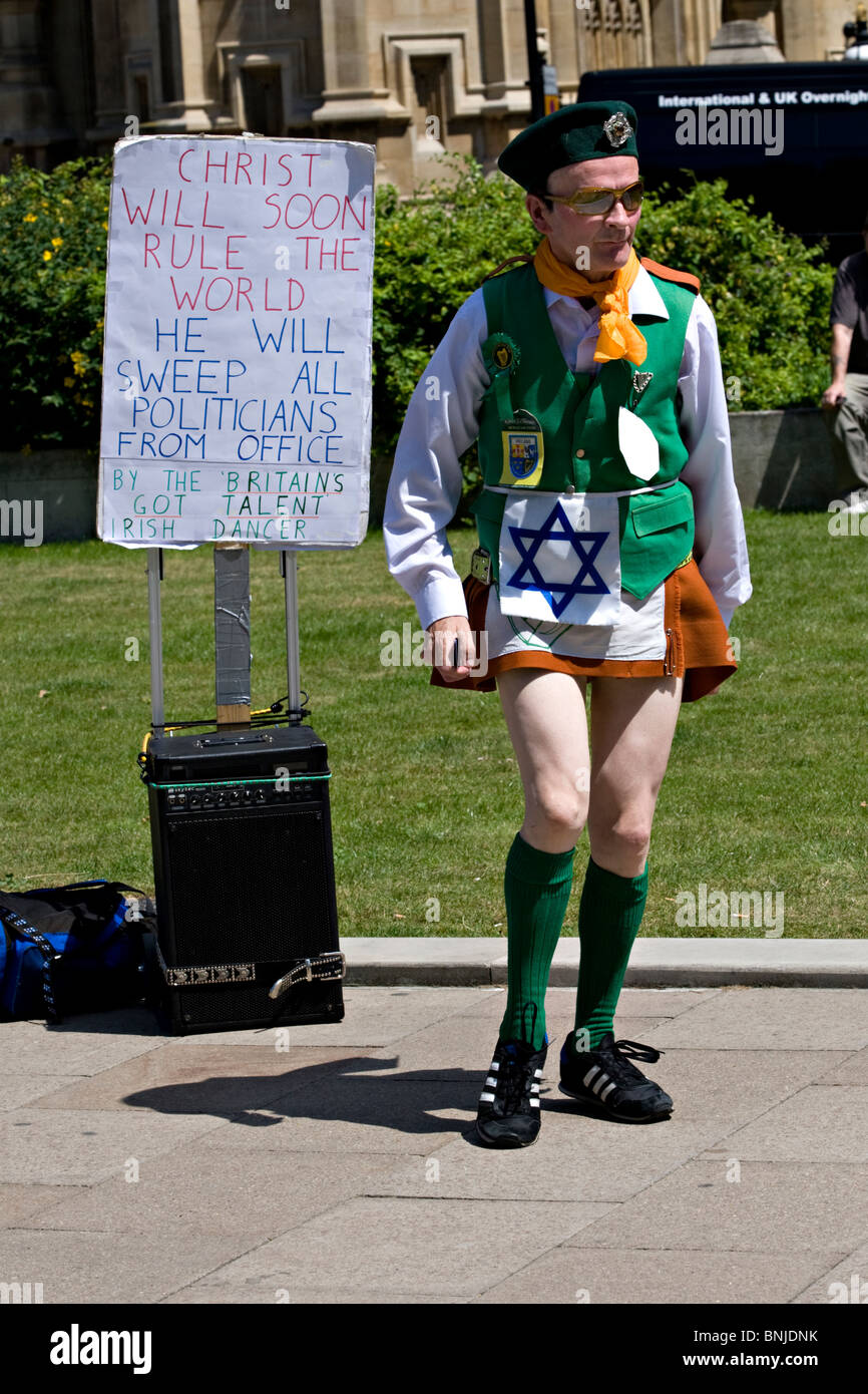 Religious activist performs a dance in College Green, Westminster, UK ...