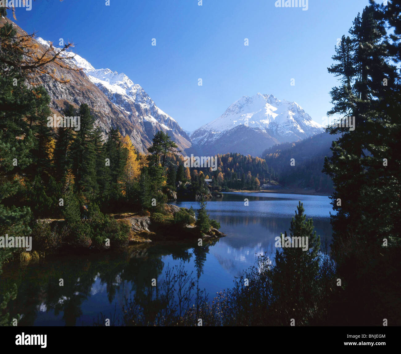 alps alpine mountain mountains lake Lake Cavloc Engadin valley Engadine ...