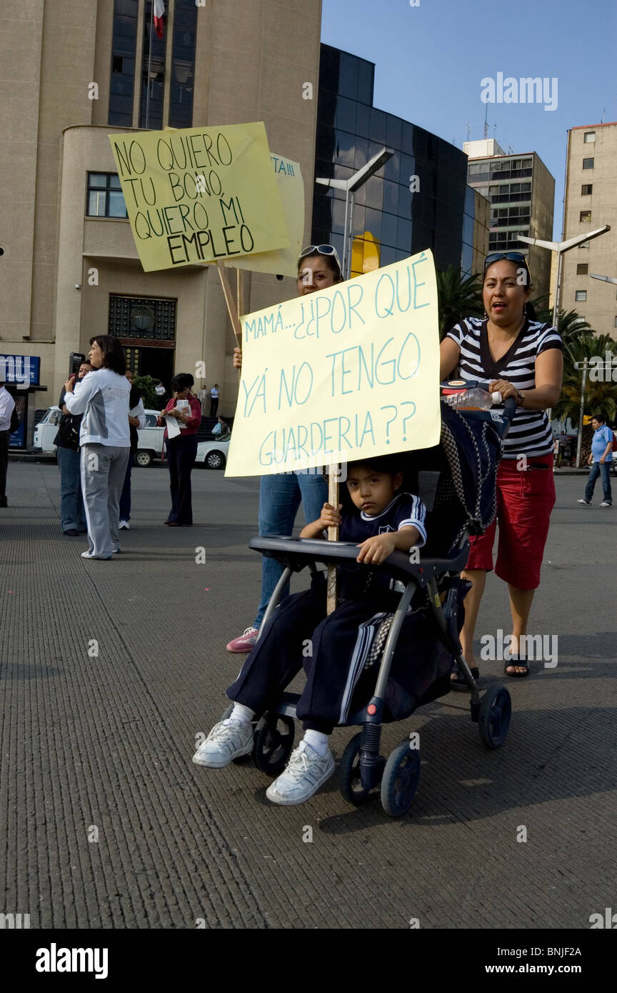 Kid in a wheelchair holding a placard during a protest against the ...