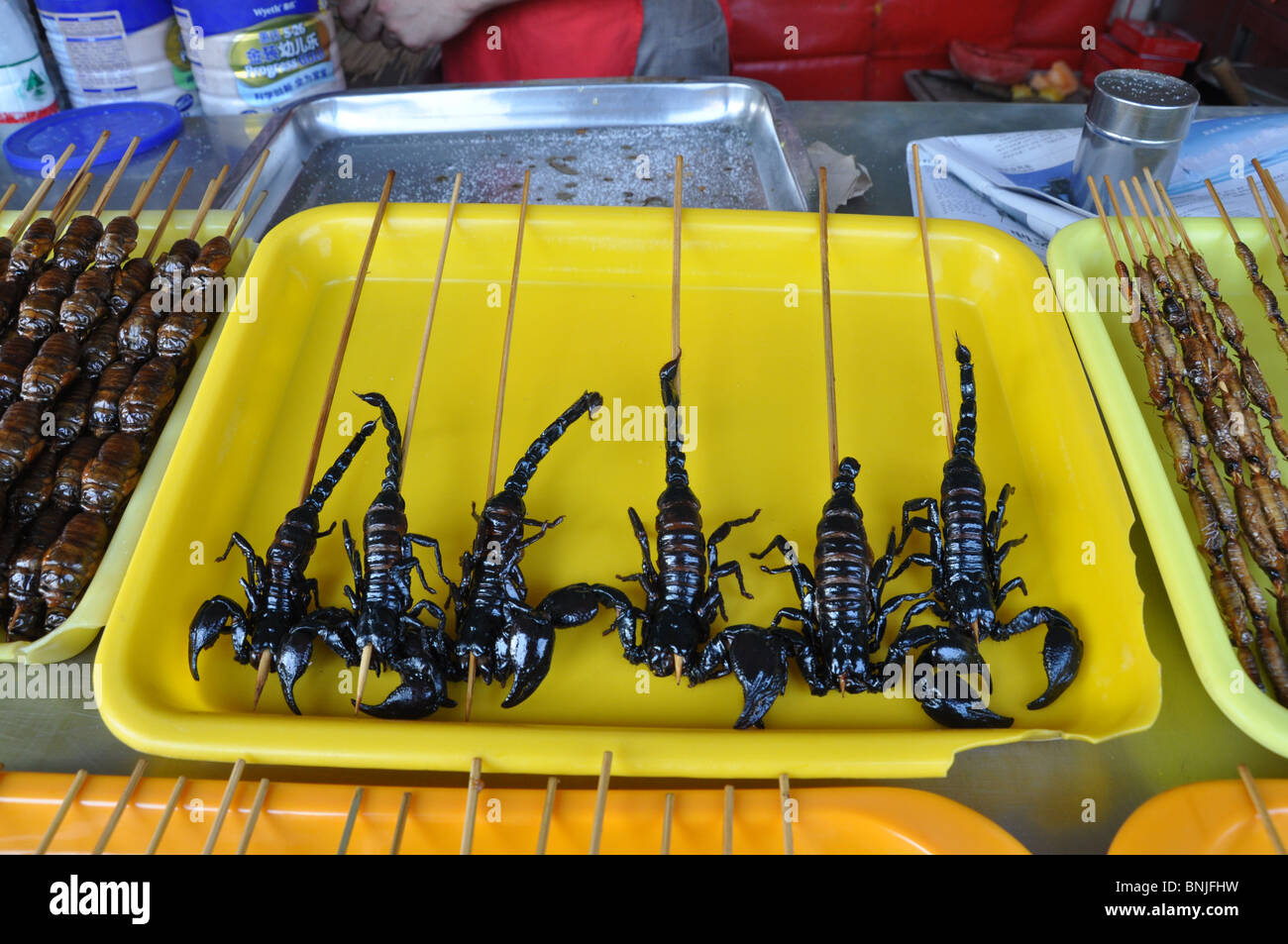 Insects on skewers being sold as snacks in Beijing street market Stock ...