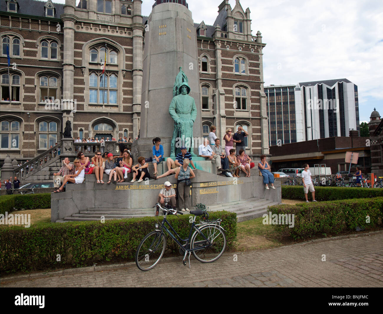 Tired crowd at the Antwerp tall ship races 2010, sitting on the ...