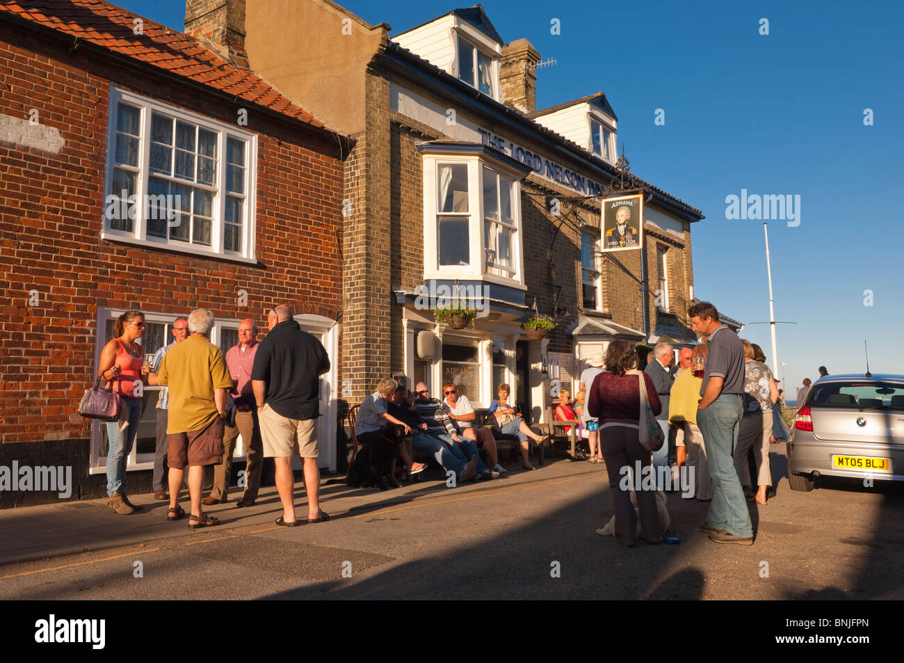 The Lord Nelson Pub with customers outside in Southwold , Suffolk ...