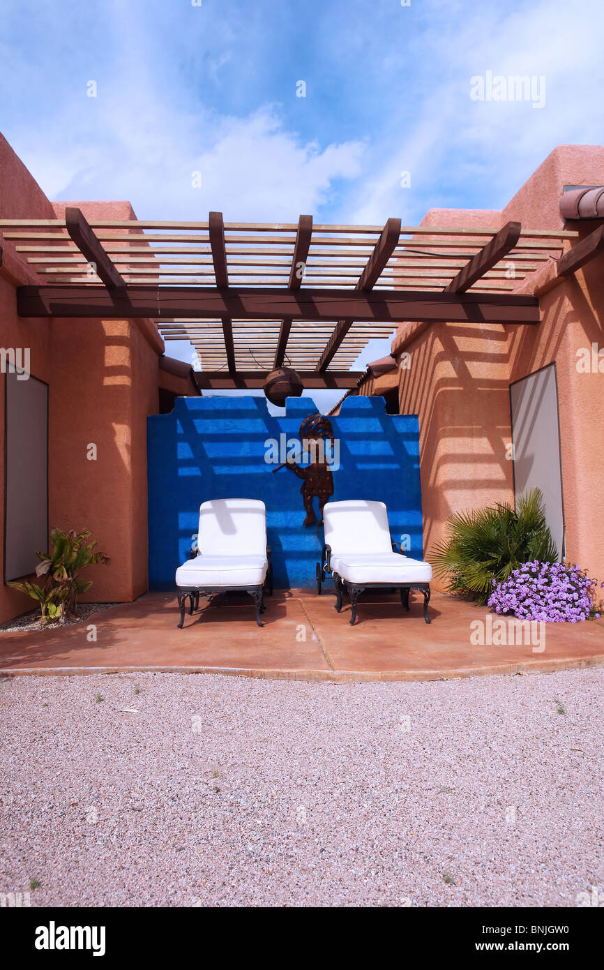 Mexican Veranda with two iron chairs against a colorful background ...