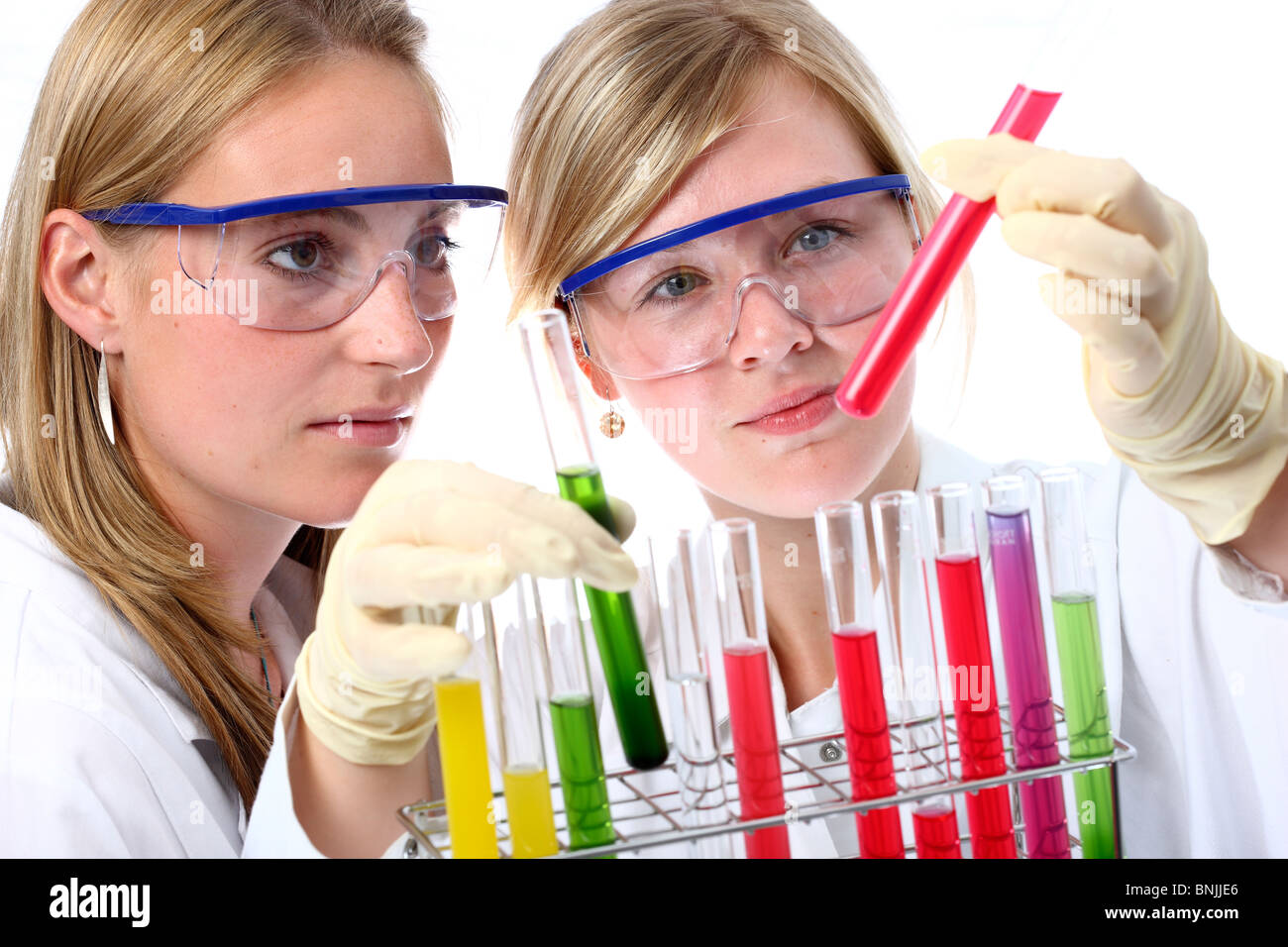 Laboratory assistants working in a chemical laboratory. Working with ...