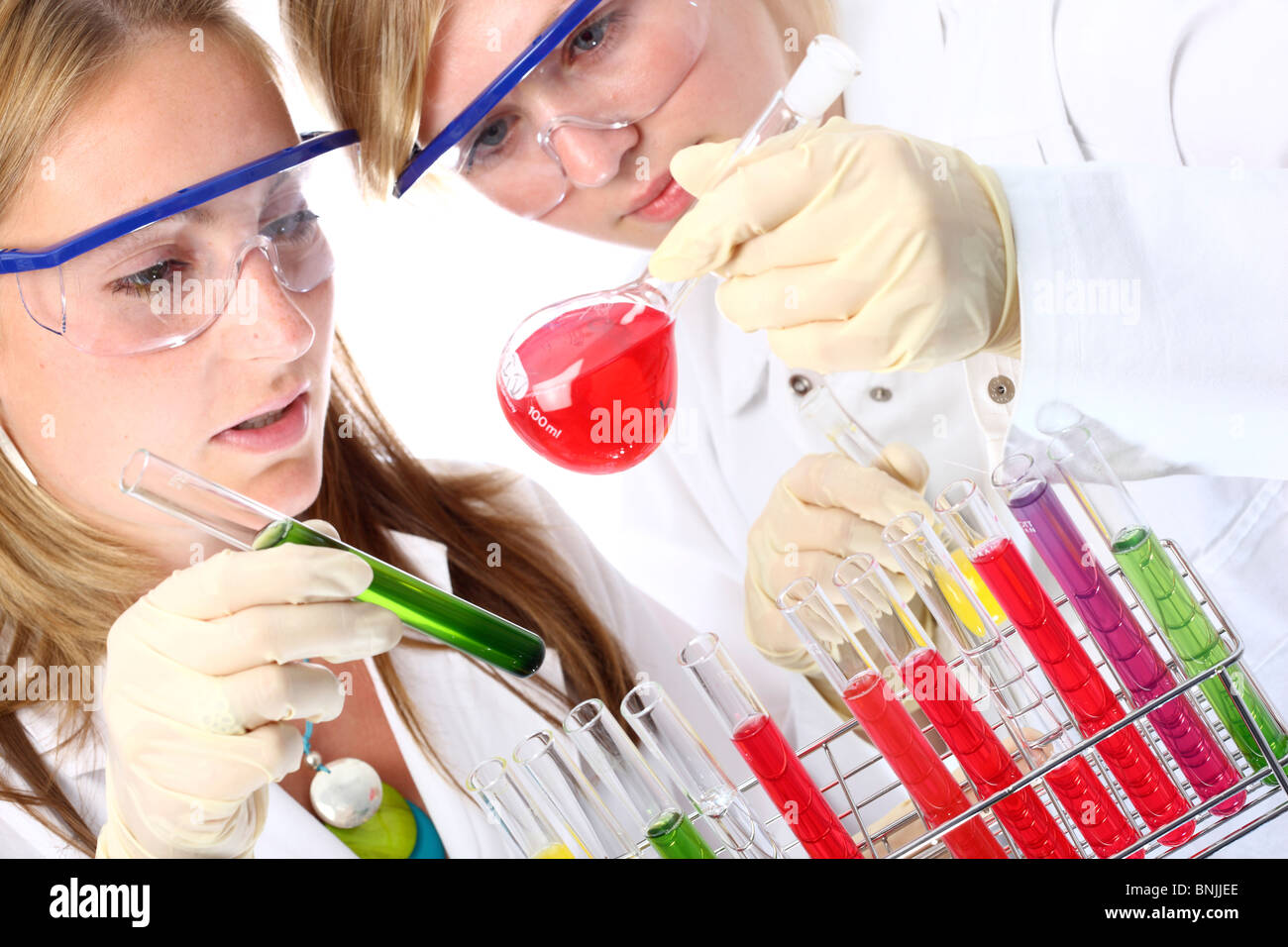 Laboratory assistants working in a chemical laboratory. Working with ...