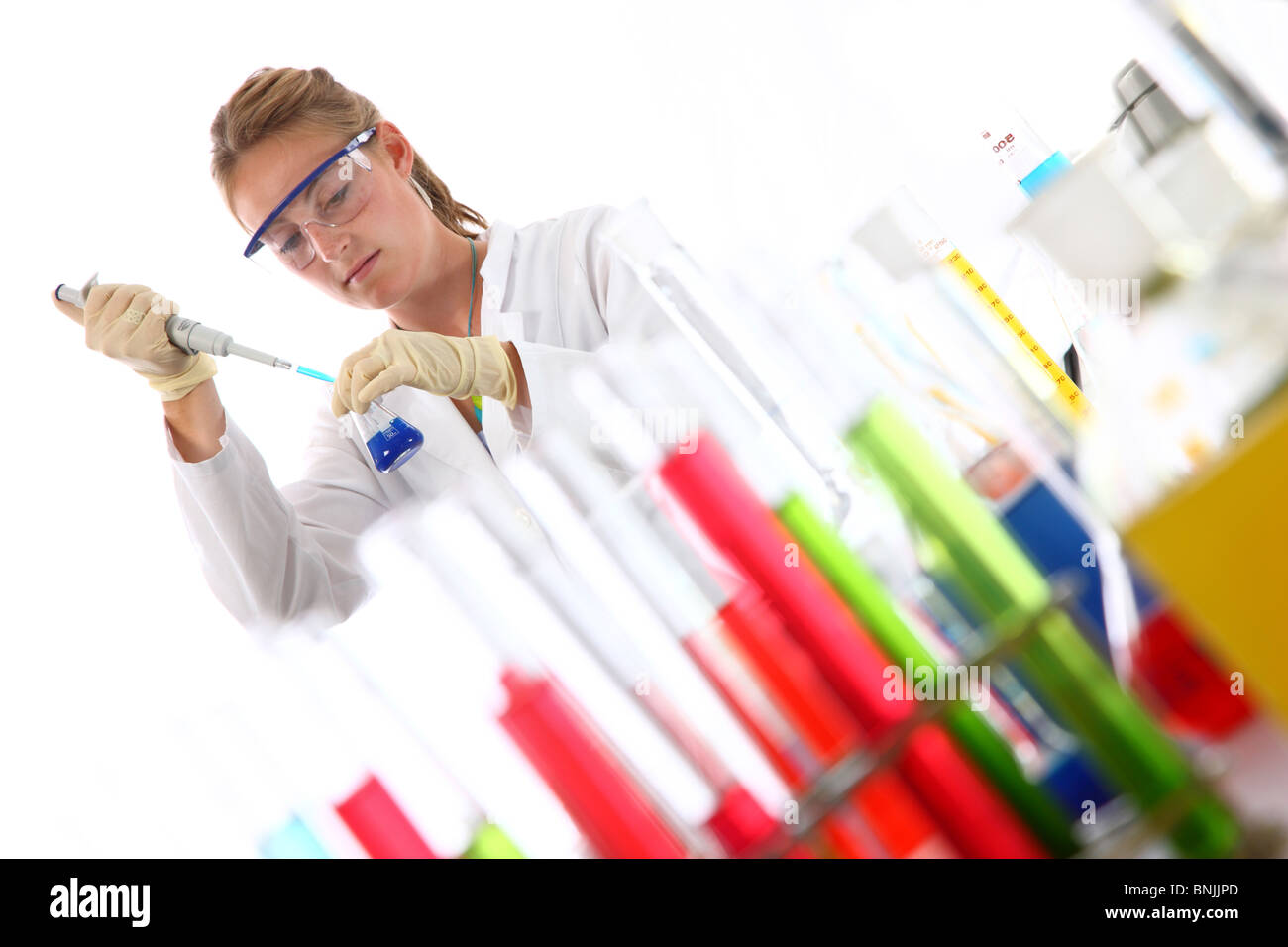 Laboratory assistant working in a chemical laboratory. Working with ...