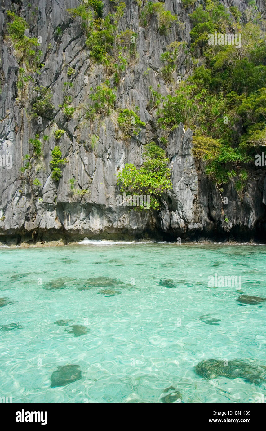 Beautiful clear water in Big Lagoon surrounded by limestone cliffs in ...