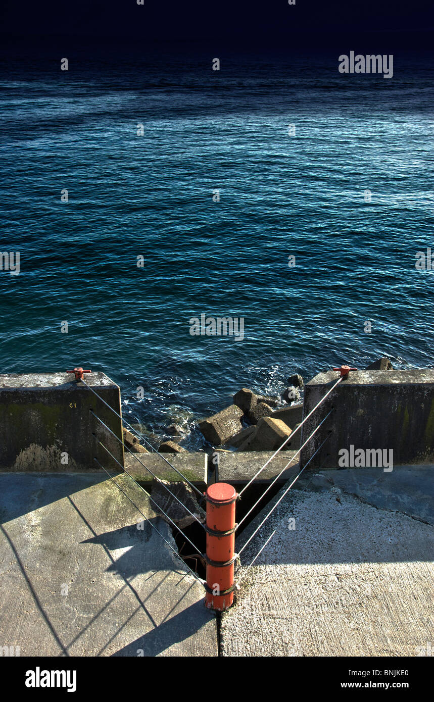Harbour wall and calm sea Stock Photo - Alamy