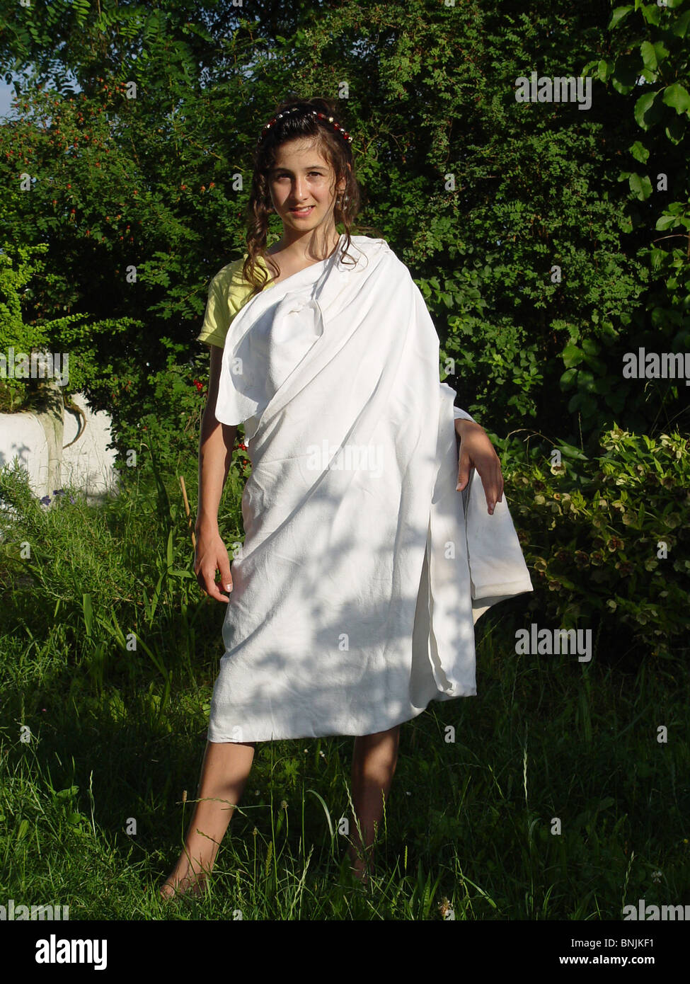 Girls teenagers meadow Toga Roman linen disguising fancy dress pose ...