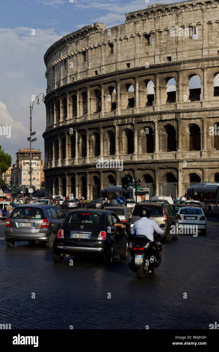 Road traffic in front of The Colosseum or Roman Coliseum, Italy Stock ...