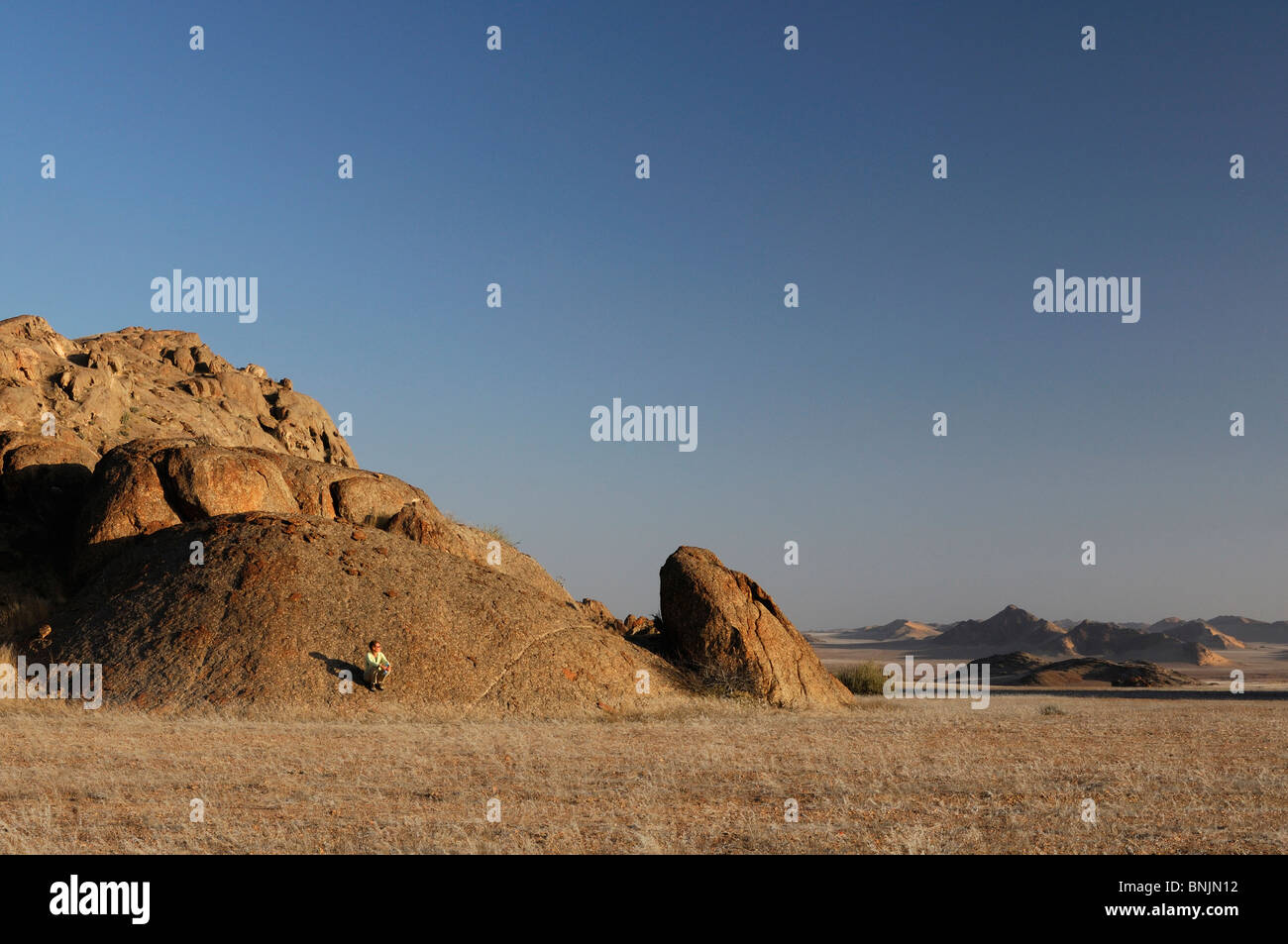 watching sunset Rocks Skeleton Coast Camp Wilderness Safaris Kaokoland ...
