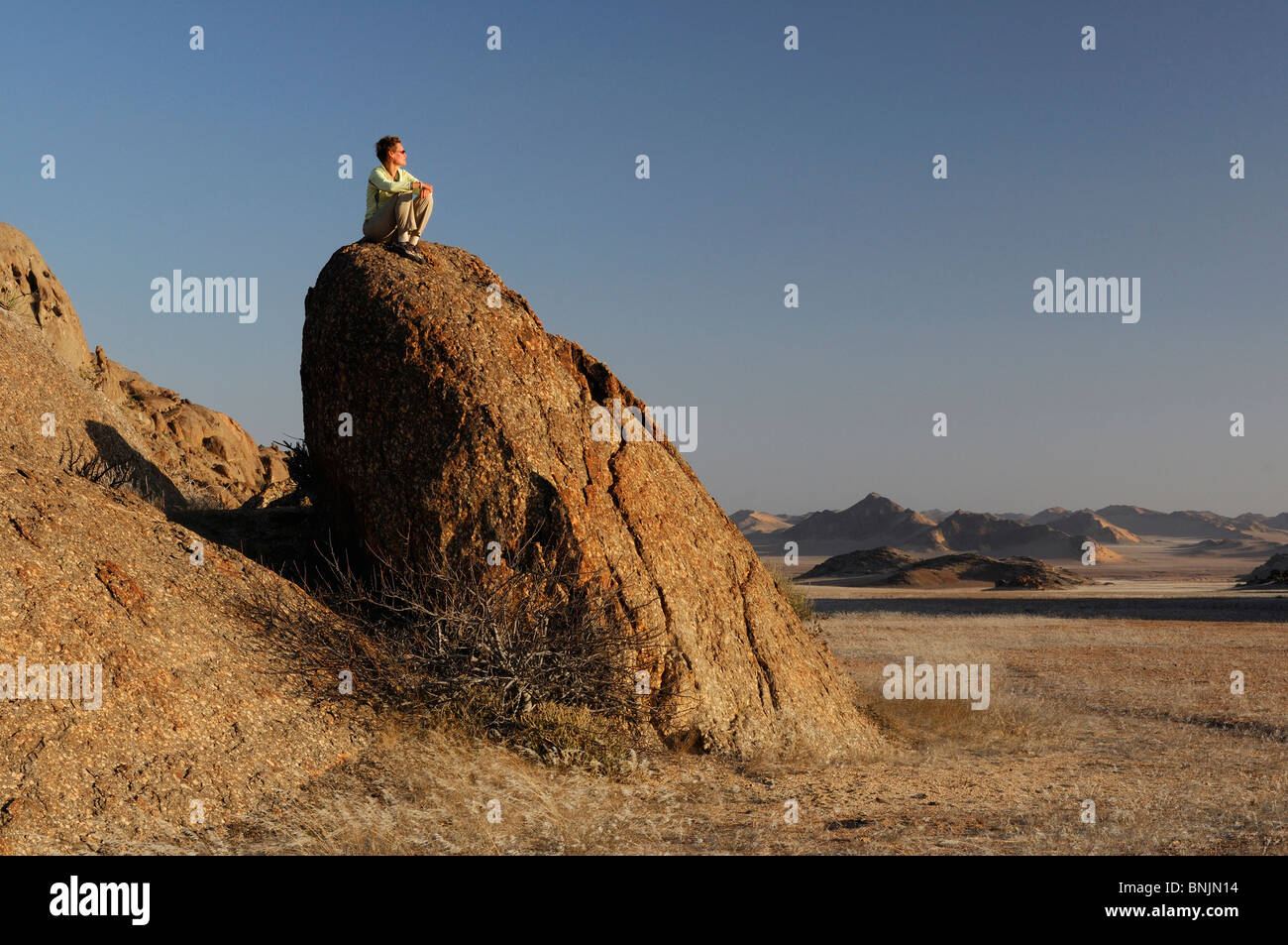 watching sunset Rocks Skeleton Coast Camp Wilderness Safaris Kaokoland ...