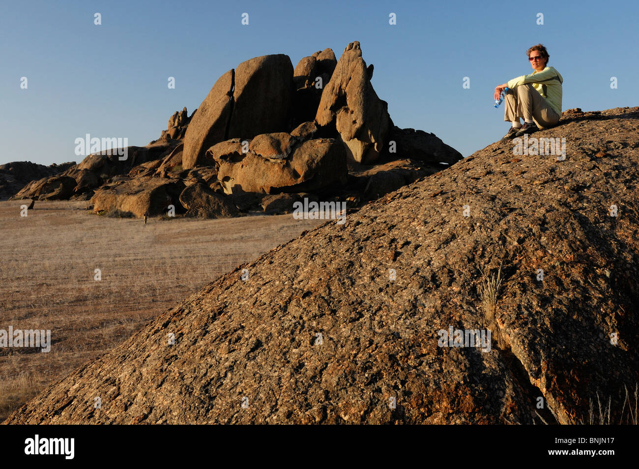 watching sunset Rocks Skeleton Coast Camp Wilderness Safaris Kaokoland ...