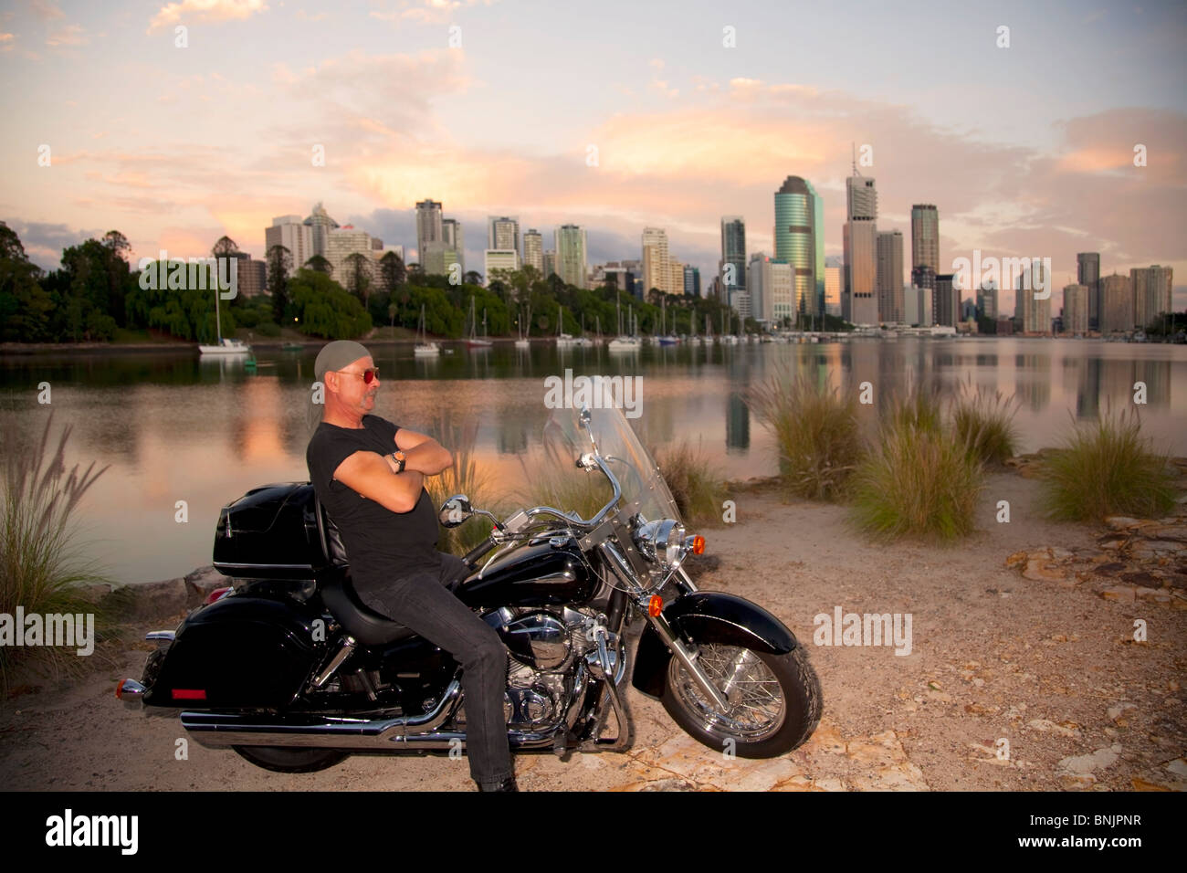 Bike rider with city background Stock Photo - Alamy