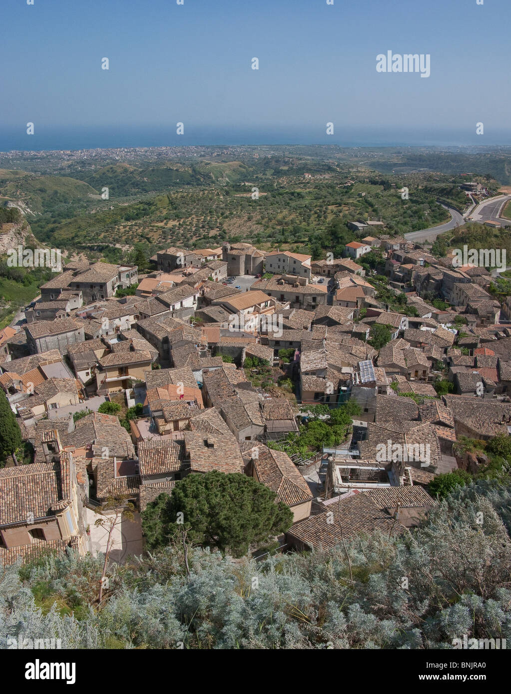 Gerace Calabria Mediterranean Italy view village houses homes bushes ...