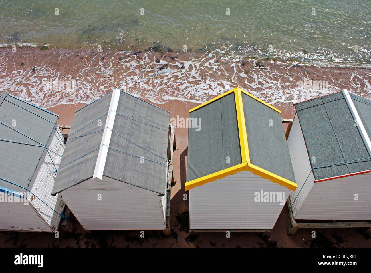 Bathing huts line the seashore at Torquay Stock Photo - Alamy