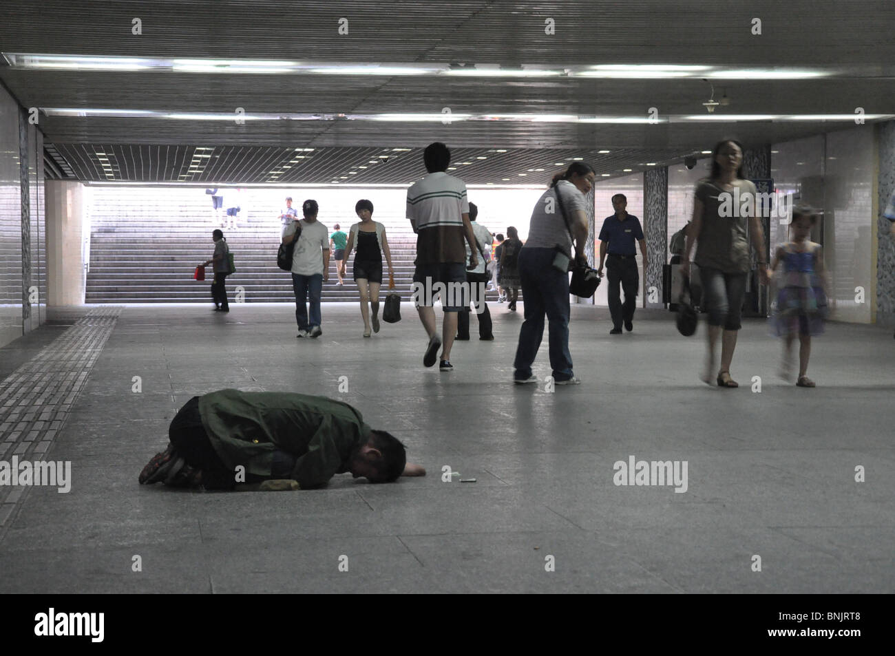 Beggar in subway, Tiananmen Square, Beijing, China Stock Photo - Alamy