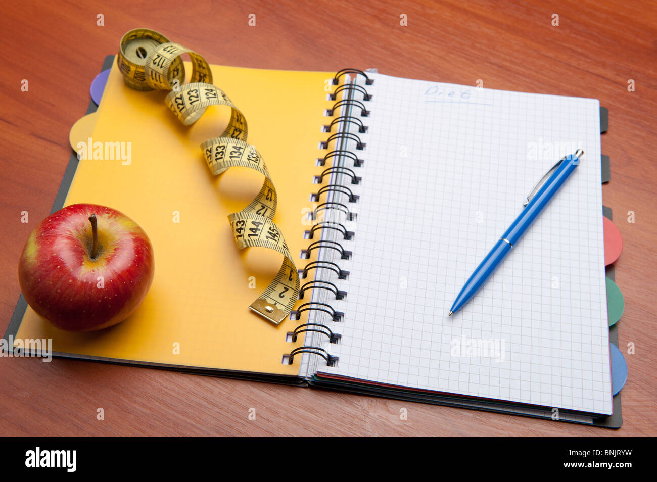 Planning of a diet. A notebook c an inscription - the Diet, a measuring ...