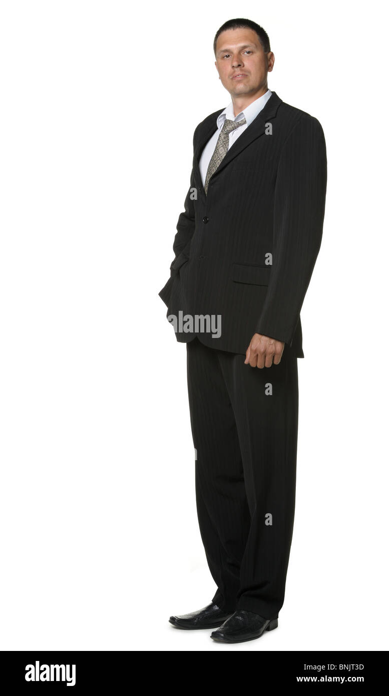 The businessman in a black suit. It is isolated on a white background ...