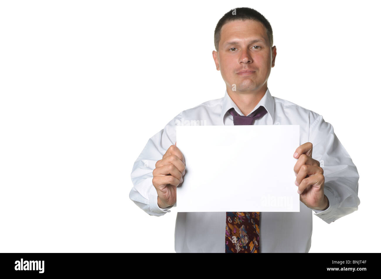 The businessman with the empty form of a paper. It is isolated on a ...