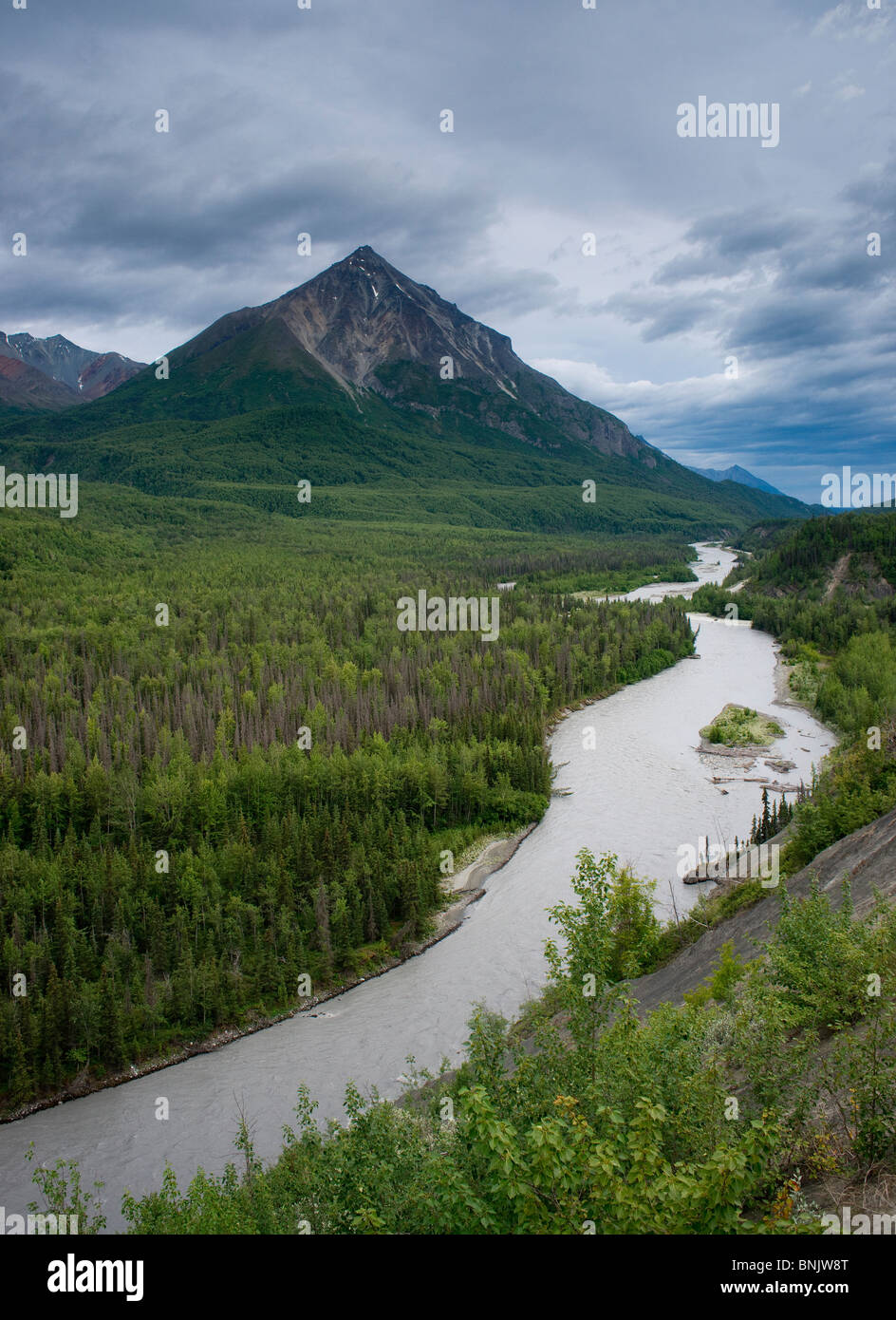 The Matanuska River runs through Alaska with The Chugach Mountains as a ...