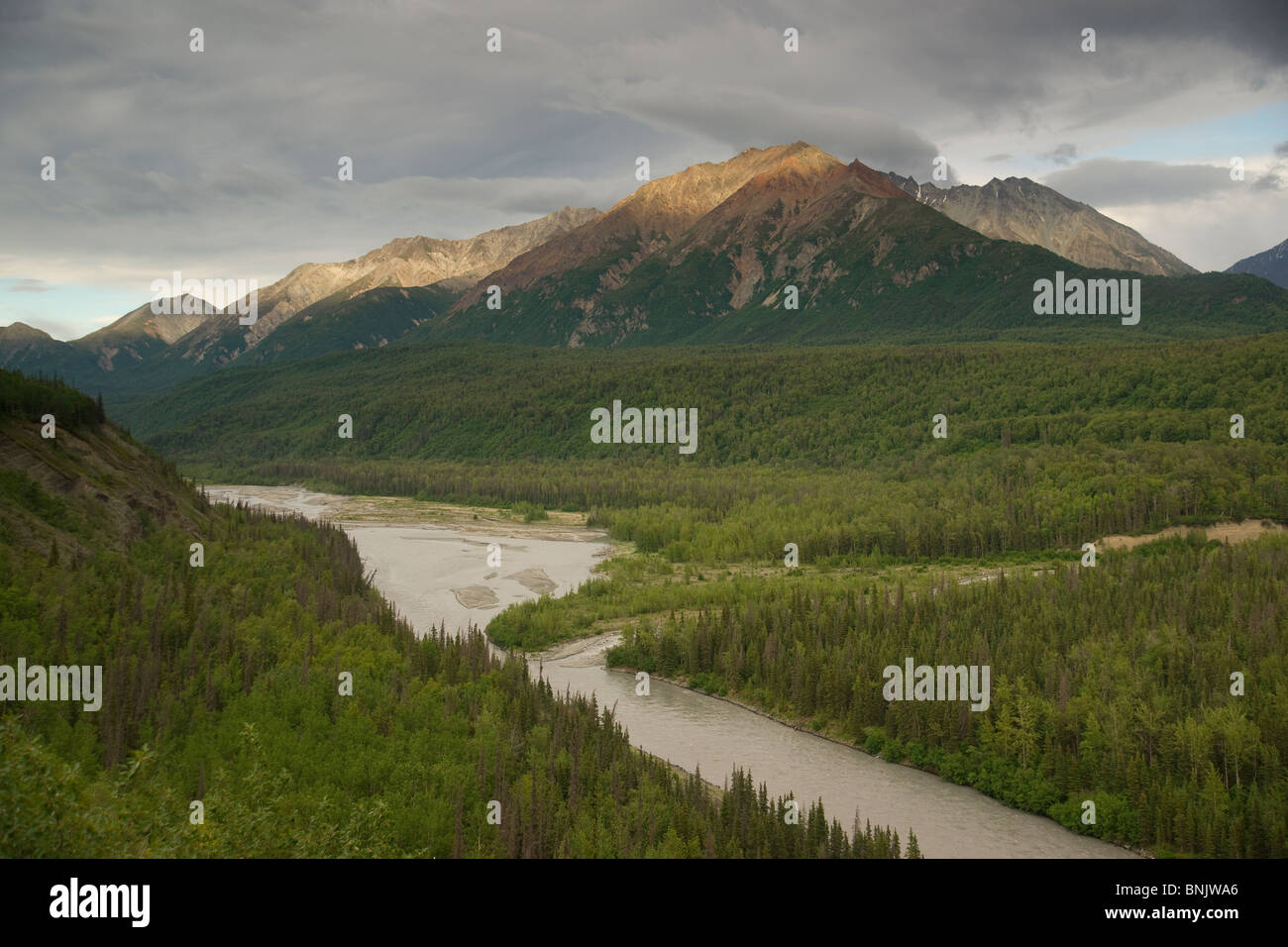 The Matanuska River runs through Alaska with The Chugach Mountains as a ...