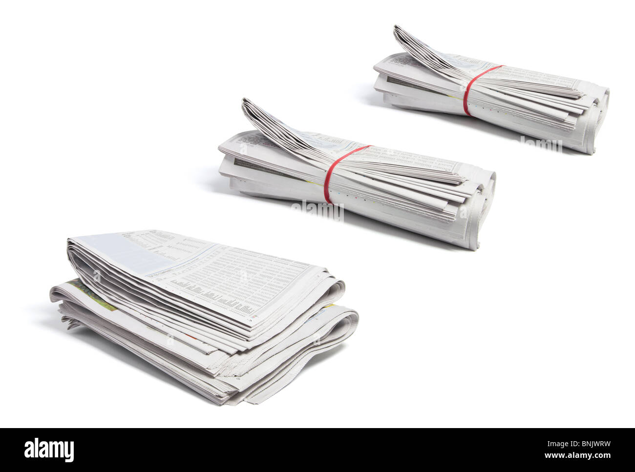 Rolled up newspapers Cut Out Stock Images & Pictures - Alamy