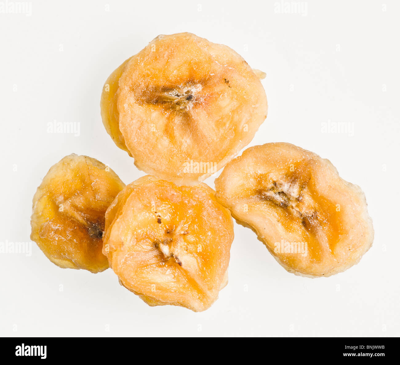 Dried sliced banana pieces on white studio background Stock Photo - Alamy