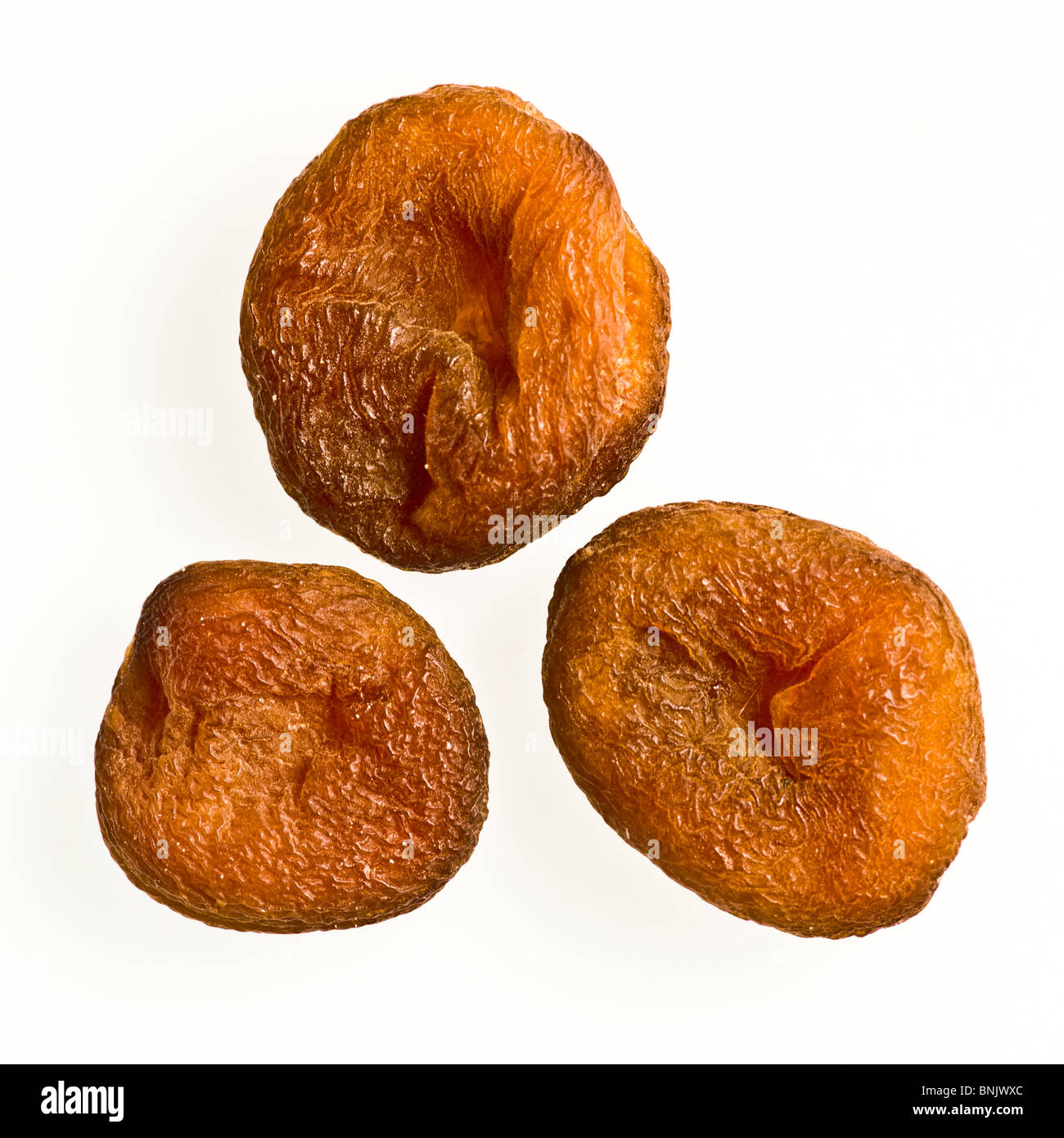 Dried apricots on white studio background Stock Photo - Alamy