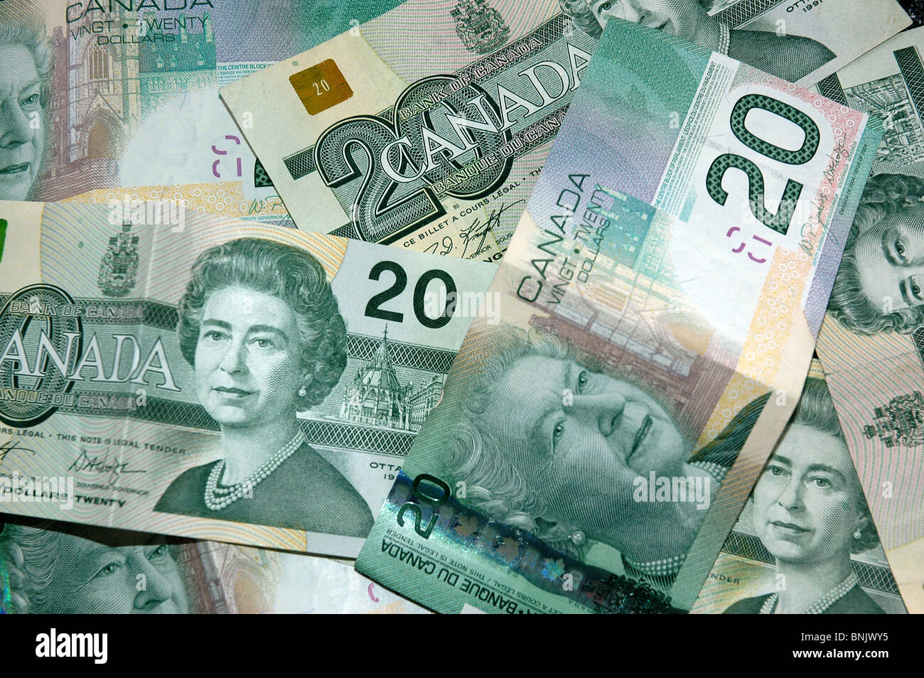 Canadian Twenty Dollar Bills With The Old And New Portraits Of The ...