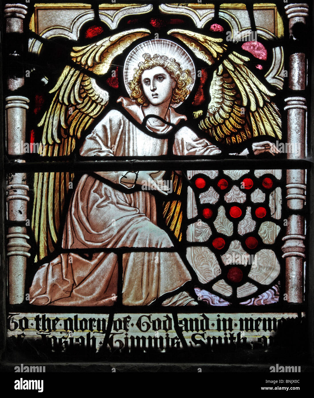 A stained glass window depicting an angel holding the Shield of the ...