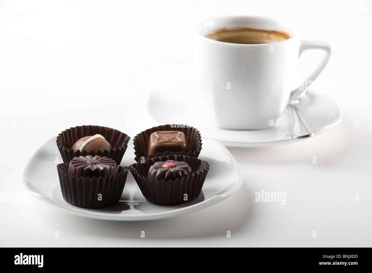 Coffee cup and chocolate Stock Photo - Alamy