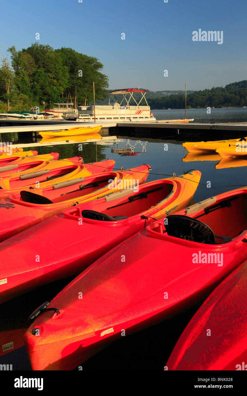Boats and colorful kayaks at a marina on Deep Creek Lake, Thayerville ...