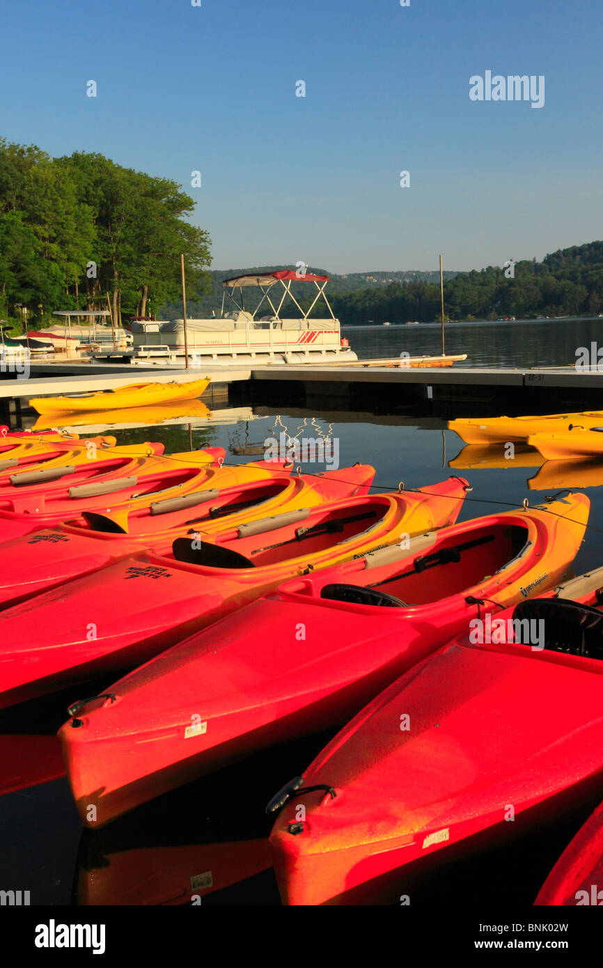 Boats and colorful kayaks at a marina on Deep Creek Lake, Thayerville ...