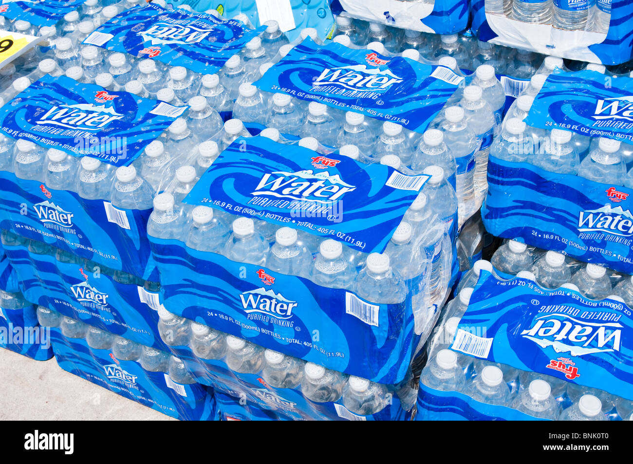 Wrapped packages of bottled drinking water for sale at a grocery store ...