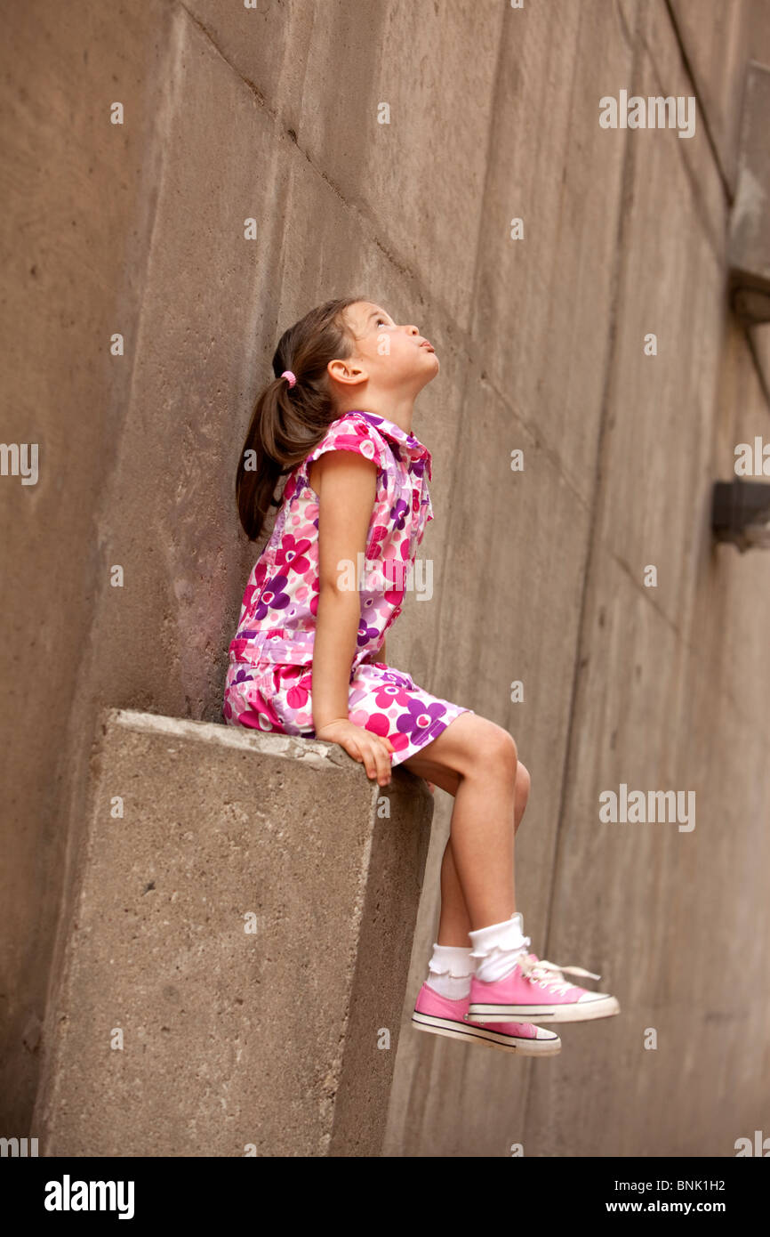 girl sitting and looking up Stock Photo - Alamy
