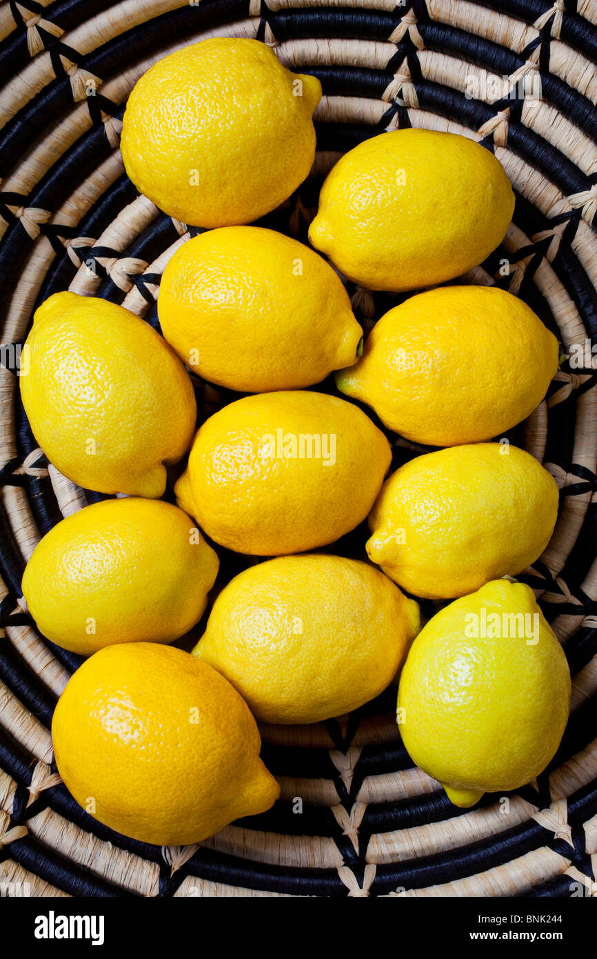 Basket full of lemons Stock Photo - Alamy