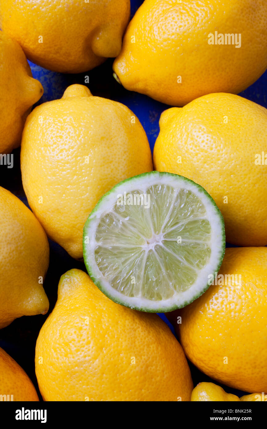 Lemons with sliced lime Stock Photo - Alamy