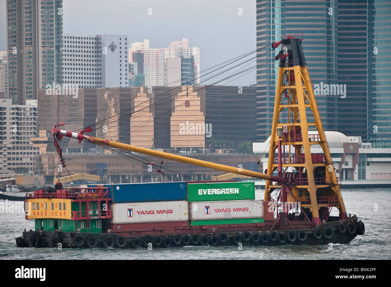 Hong Kong, Small container ship in Victoria Harbour. These move ...