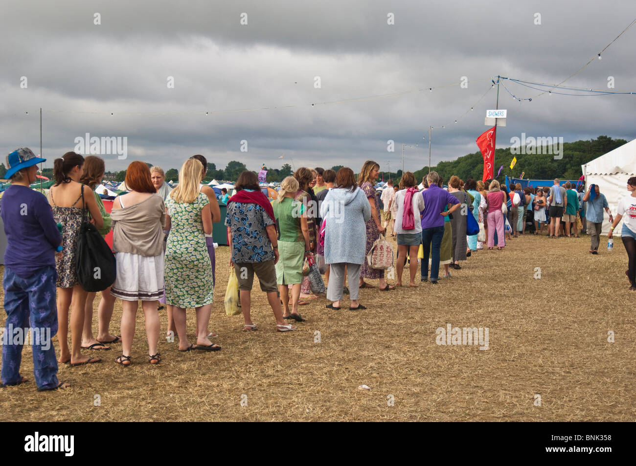 Sunday morning long shower queue at a music festival, WOMAD 2010 Stock ...
