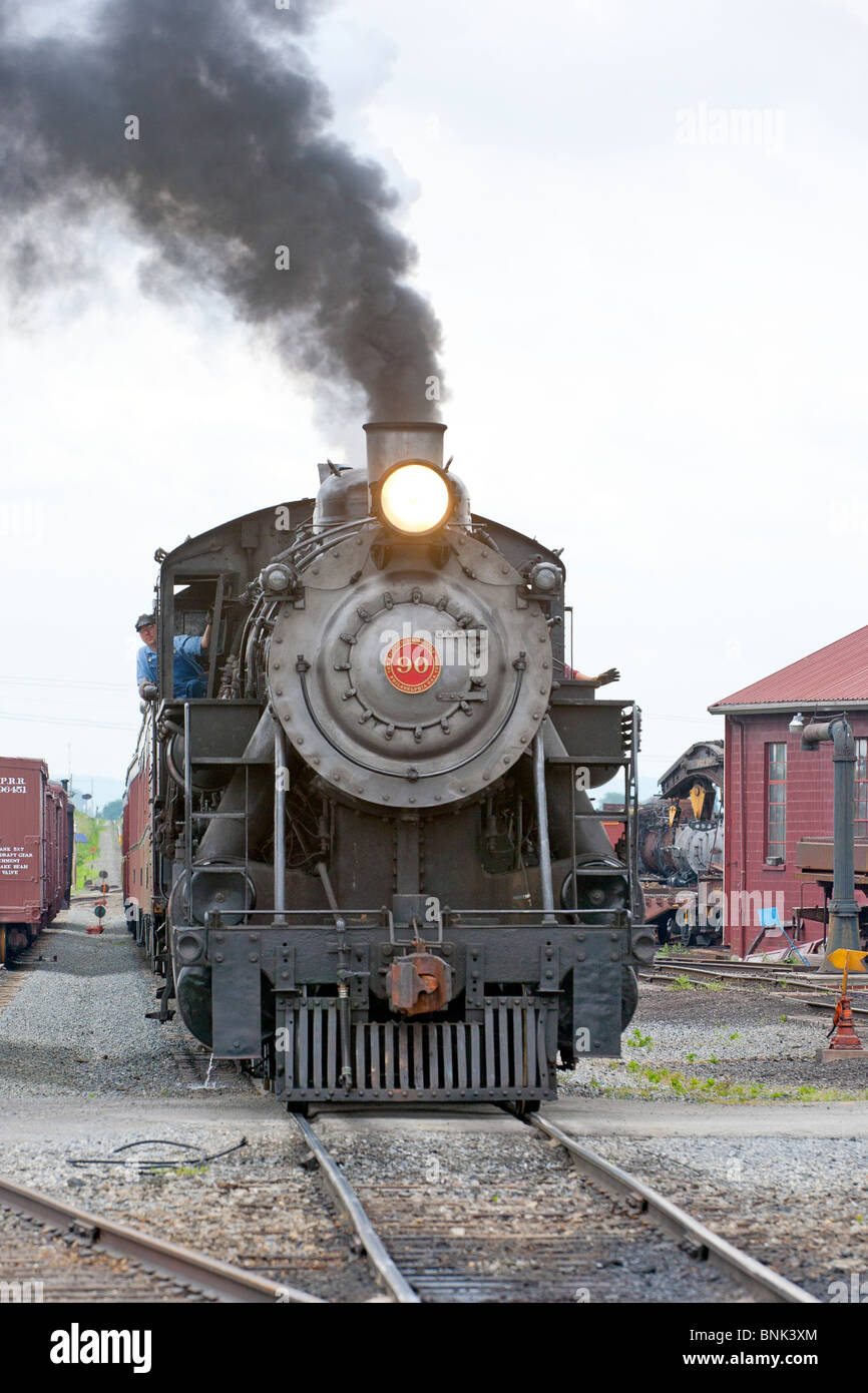 A Steam Locomotive Train traveling across the horizon Stock Photo - Alamy