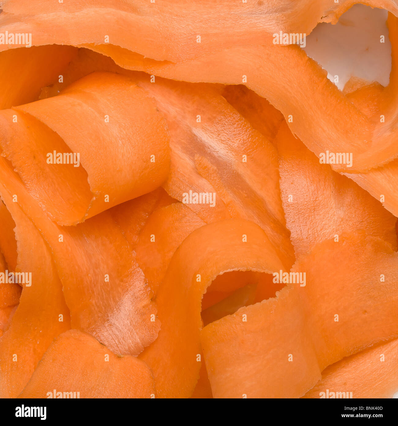 Abstract Carrot background texture of thinly sliced ribbons of carrot ...