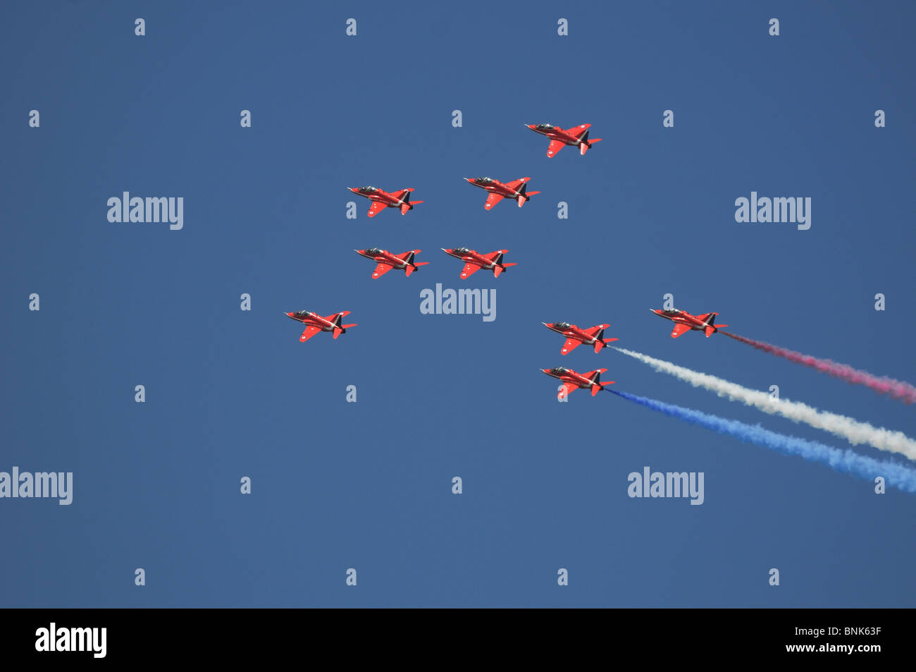 Red Arrows display team in flight at the Farnborough International ...