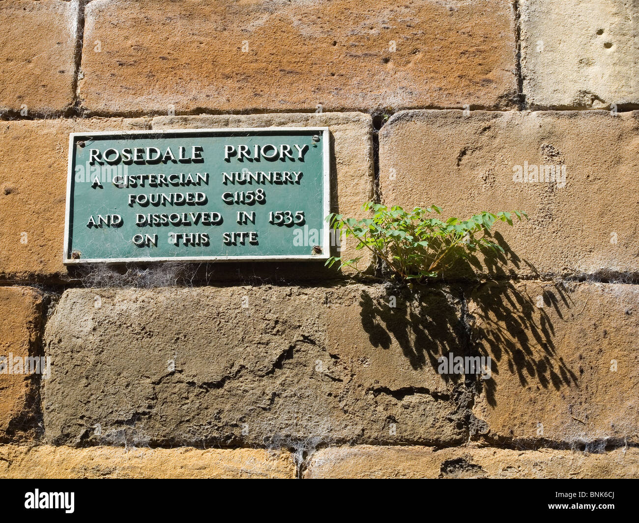 A commemorative sign on the ruins of Rosedale Priory a Cistercian ...